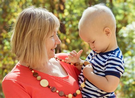 Premium Photo Happy Grandma With Grandson In The Park