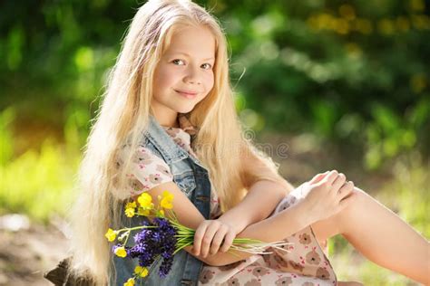 Little Blonde Girl With Bouquet Of Flowers Stock Image Image Of Floral Dress 91721263