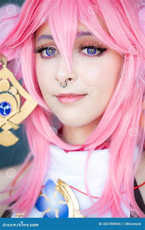 Female Cosplayer In A Pink Anime Costume Wearing Pink Hair Stock Image Image Of Victorious