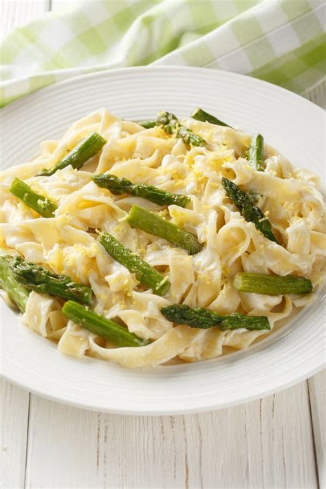 Fettuccine Pasta With Asparagus Lemon In A Creamy Cheese Sauce Close