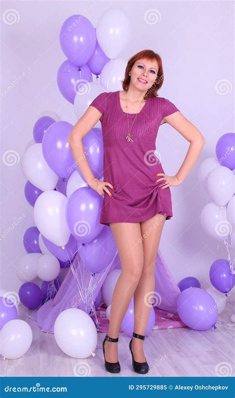 Long Legged Redhead Girl In Shiny Stockings And Minidress Posing At Ballons Stock Image Image
