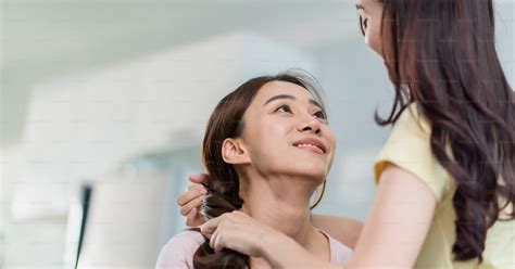 Asian Beautiful Lesbian Women Couple Combing Girlfriends Hair In House Attractive Two Female