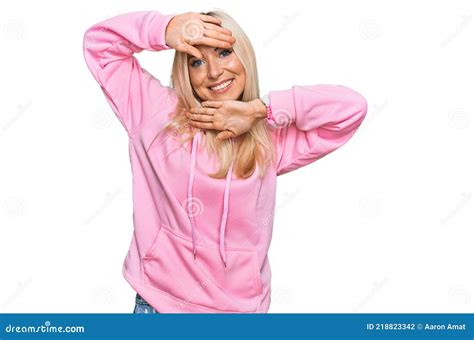 Young Blonde Woman Wearing Casual Sweatshirt Smiling Cheerful Playing Peek A Boo With Hands