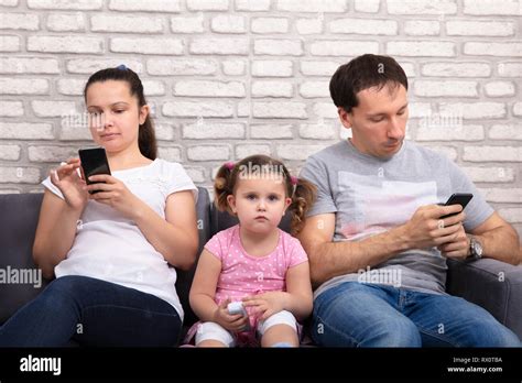 Using Mobile Phone Ignoring Hi Res Stock Photography And Images Alamy