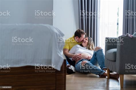 Formally Dressed Couple Are Lying On Their Bed Enjoying The Wifes Pregnant Belly Congratulations