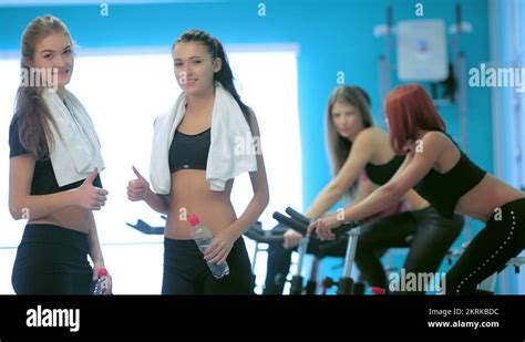 Female Athletes Girl Posing In The Gym And Look Into The Camera Showing A Thumbs Stock Video