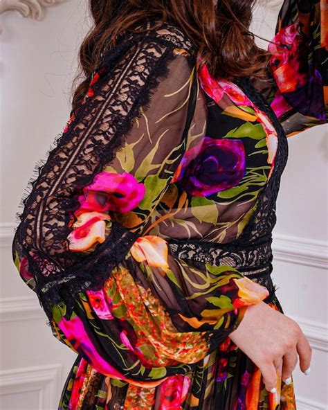 Premium Photo A Woman In A Floral Dress Is Posing For A Photo