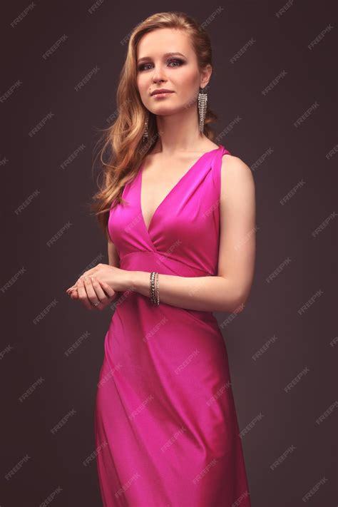 Premium Photo Sexy Girl In Evening Dress Posing Over Dark Background