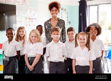 Portrait Of Elementary School Pupils Wearing Uniform Standing In