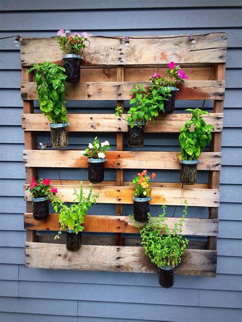 My Diy Wooden Pallet Wall Planter Have A Mix Of My Favorite Herbs And Flowers Herb Garden