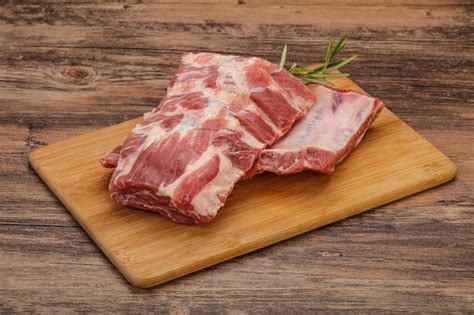 Premium Photo Raw Pork Ribs Served Rosemary