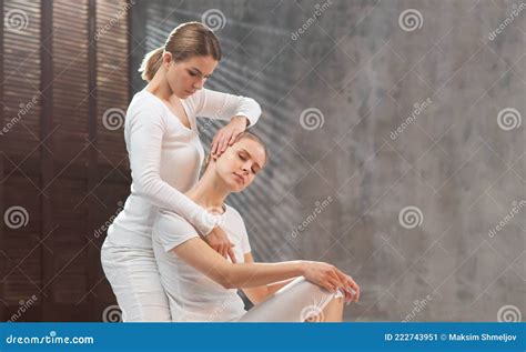 Professional Masseur Doing Thai Massage Therapist Is Making Body Stretching Exercises To The