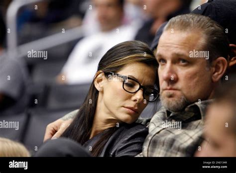 Actress Sandra Bullock Left And Her Husband Jesse James Attend The
