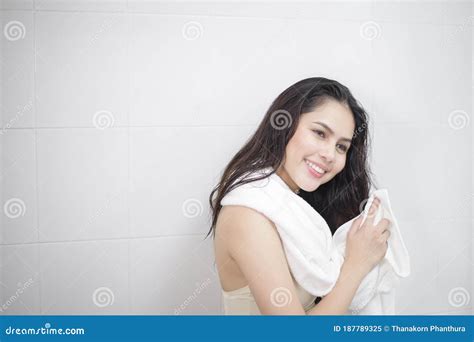 A Woman Is Drying Her Hair With A Towel After Showering Stock Image Image Of Body Lady 187789325