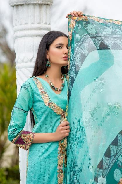Premium Photo Shy Girl Hiding Her Face With Scarf In A Garden Wearing Desi Dress For Fashion Shoot