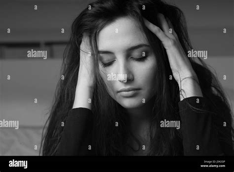 Desperate Woman With Head In Hands She Is Having An Headache Depression And Sadness Concept