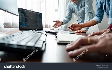 Team Programmer Working Find Solution Problem Stock Photo 1828718756