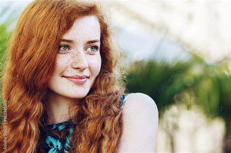 Outdoor Close Up Portrait Of Young Beautiful Happy Smiling Redhead Girl With Freckles Long