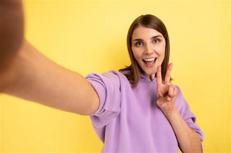 Premium Photo Woman Taking Selfie Looking At Camera Pov Point Of View Of Photo Showing Victory