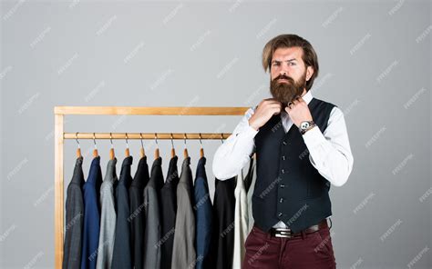 Premium Photo Man Picking Suit From Personal Wardrobe Male Fashion Concept