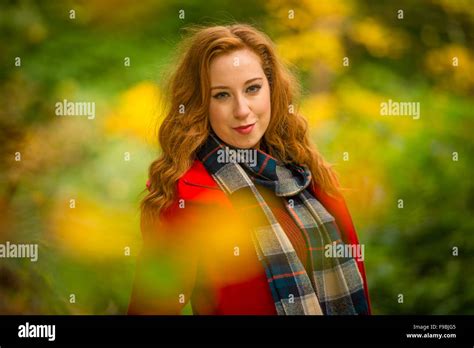 A Young Redhaired Redhead Red Haired Woman Alone Outdoors In Woodland On An Autumn October
