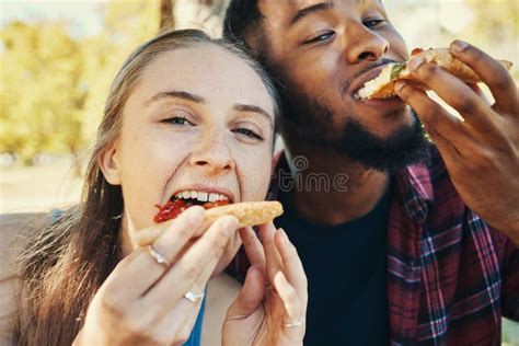 Pizza Love And Happy Couple Eating Fast Food While On A Date Together In Nature In A Garden
