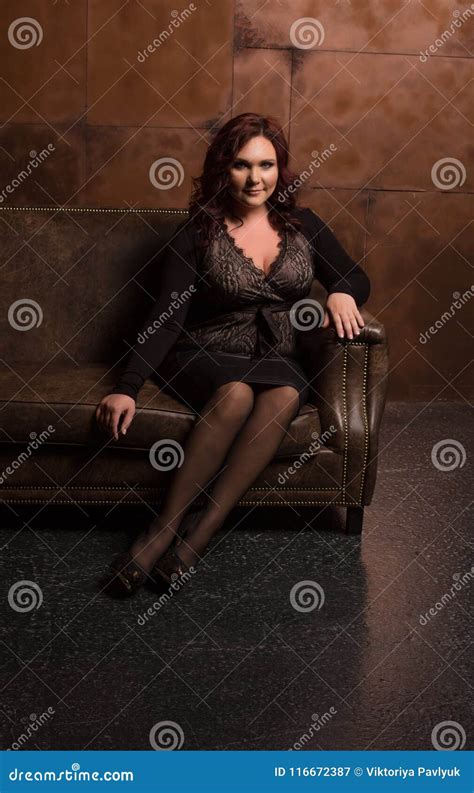 Stunning Mature Woman In Fashionable Apparel Posing In The Dark Stock Image Image Of Apparel