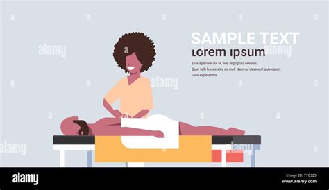 Young Man Having Back Massage African American Masseuse Massaging Patient Body Guy Relaxing