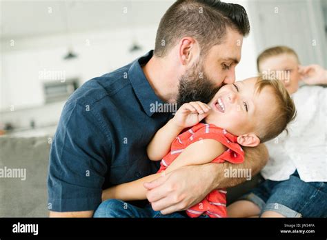Father Kissing Son 2 3 On Cheek Stock Photo Alamy