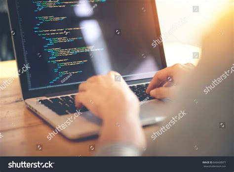 closeup coding on screen woman hands coding html and programming on screen laptop development