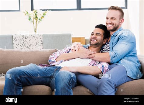 Gay Couple Hugging On Couch Fotografías E Imágenes De Alta Resolución Alamy