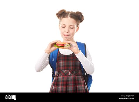 Girl eating sandwich school Banque de photographies et dimages à haute