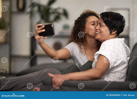 Capturing All Our Memories A Lesbian Couple Taking A Selfie Of The Couch At Home Stock Image