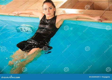 Seductive Woman Relaxing In Water At Poolside Stock Image Image Of Woman Female 65445429