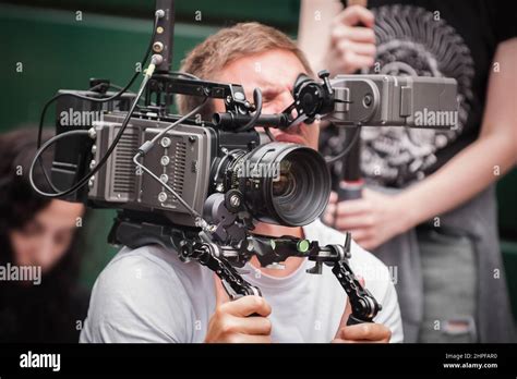 Behind The Scenes Cameraman Shooting The Film Scene With His Camera On Outdoor Set Photography