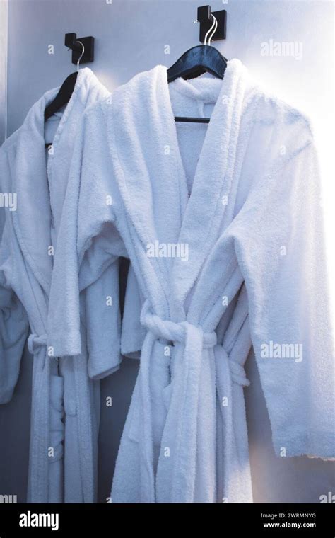 Two White Bathrobes On Hangers Spa Salon Interior Cotton Bathrobes In Wellness Centre Cozy