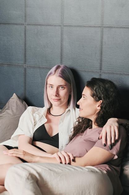 Premium Photo Lesbians Sitting On Bed