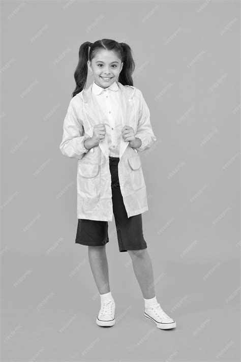 Premium Photo Cute Schoolgirl Feel Protected Happy Schoolgirl Wear Raincoat Invest In Durable